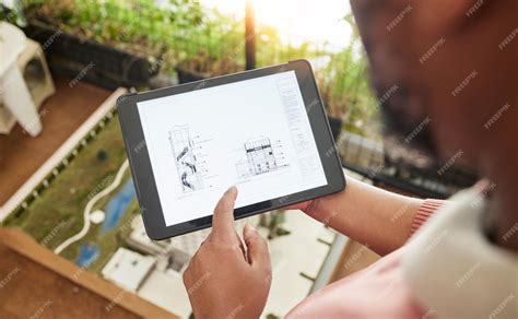 Premium Photo Hands Tablet And Architecture Design With Blueprint Model And Planning For