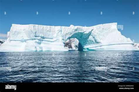 Massive Tabular Iceberg With Arch Shape Booth Island Antarctica Stock
