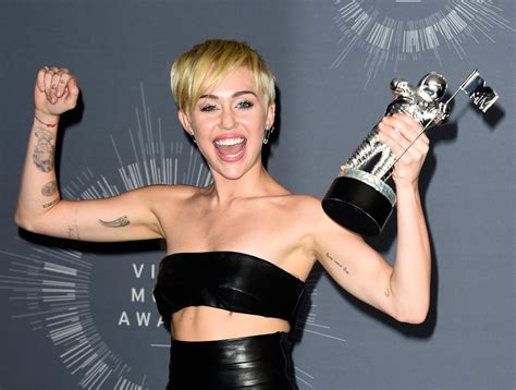 A Guide To Miley Cyruss Most Meaningful Tattoos Popsugar Beauty