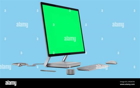A Computer Setup Featuring A Monitor With A Green Screen Keyboard