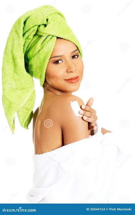 Attractive Woman Rubbing A Body Lotion On Her Arm Side View Stock