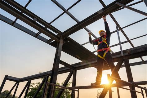 Premium Photo A Construction Worker Working At Height Equipment Using The Hook For Safety Body
