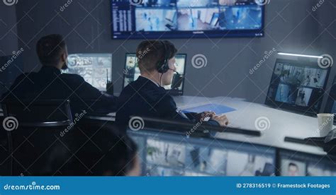 Female Security Officer Watches Security Cameras With Male Colleagues Stock Image Image Of