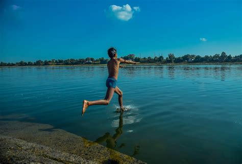 Man Jumping Into The River PixaHive
