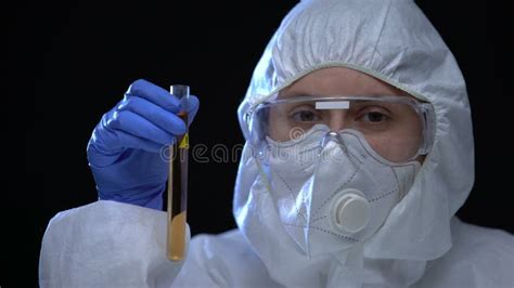 Female Lab Worker Examining Test Tube With Detergent Chemistry Caution Sign Stock Video