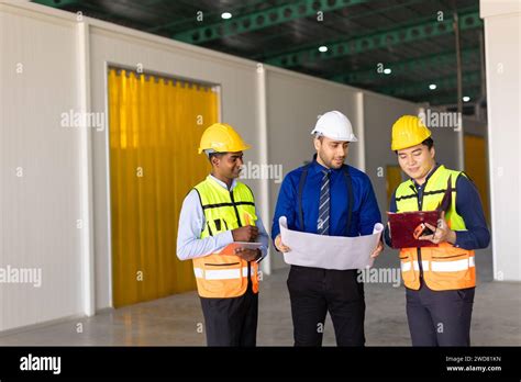 Engineer Builder Team Working With Architect Designer Work Inspect Large Building Factory
