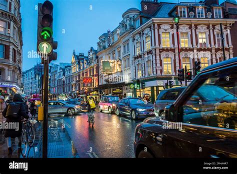 Heavy Traffic At Night On Shaftesbury Avenue A Famous Street In The