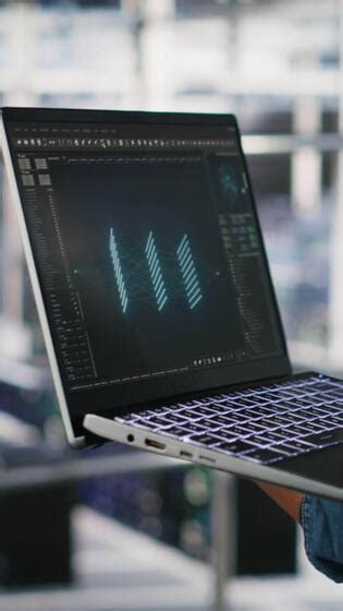 Vertical Close Up Of Admin In Data Center Using Laptop To Monitor Neural Network Llm