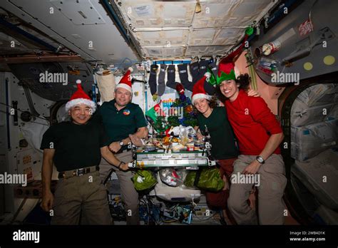 iss 25 december 2023 four expedition 70 crewmates join each other