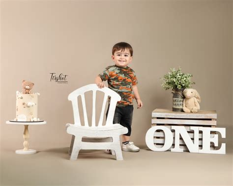 دکور تولد آتلیه کودک تیرشات تم تولد