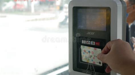 Pay With A Smart Card Using A Paypass Reader At A Ticket Machine On Bus