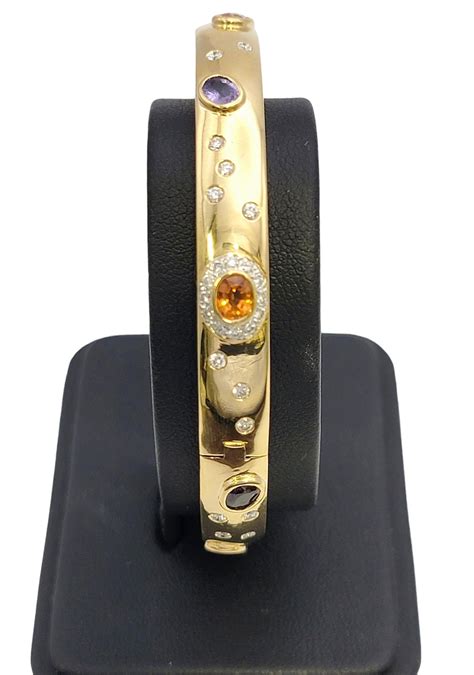 562 Carat Total Multi Colored Sapphire And Diamond Yellow Gold Bangle