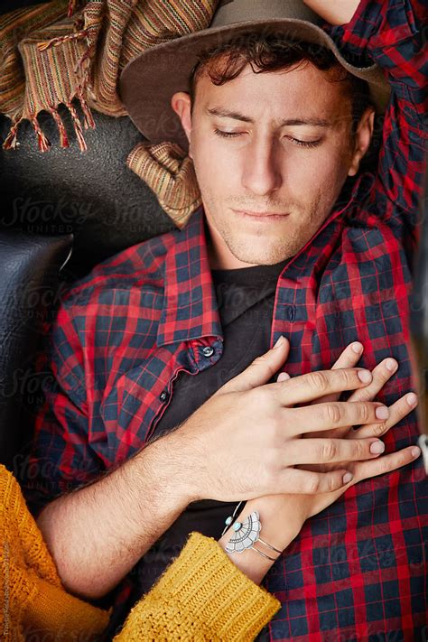 Millennial Couple Napping In The Back Of Their Truck On A Road Trip