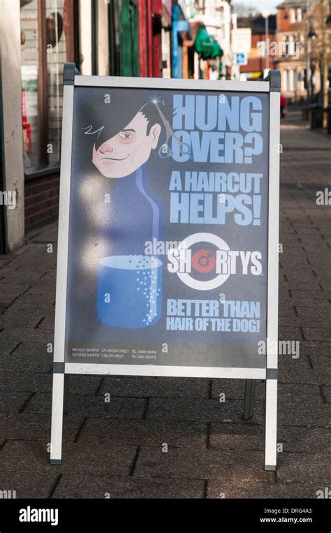 Unusual Wording On A Street Hoarding Outside A Hairdressers Salon Stock