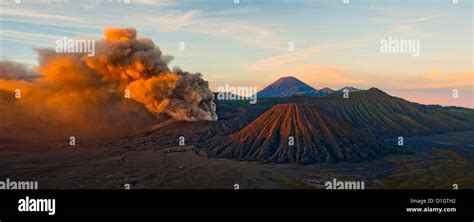 Mount Bromo Gunung Bromo An Active Volcano Erupting At Sunrise Throwing Up Ash Clouds East