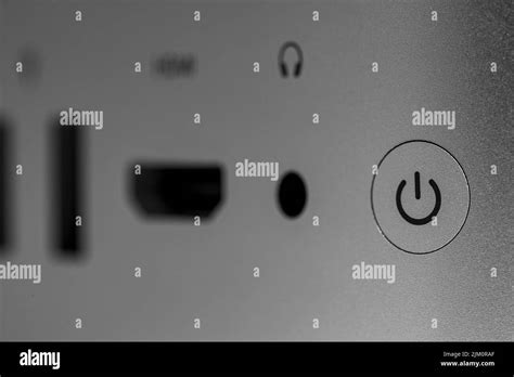 Focus On Power Button Low Key Macro Closeup Still Life Of Modern Desktop Computer System Stock