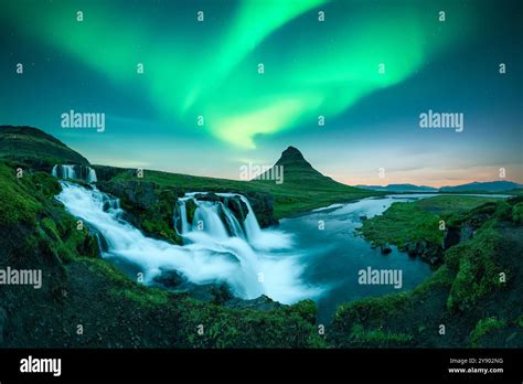 Kirkjufellsfoss Waterfall Under Incredible Sky With Polar Lights
