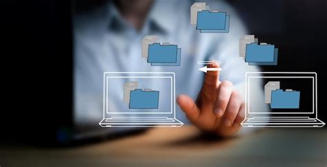 Premium Photo Transferring Files Between Laptops On A Virtual Screen