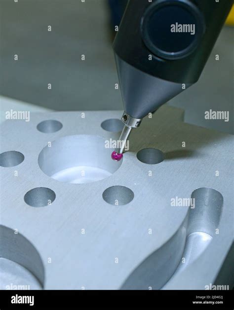 head with integral touch trigger probe of measuring machine working