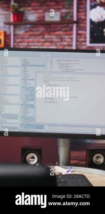vertical video lines of code written on pc workstation screen on