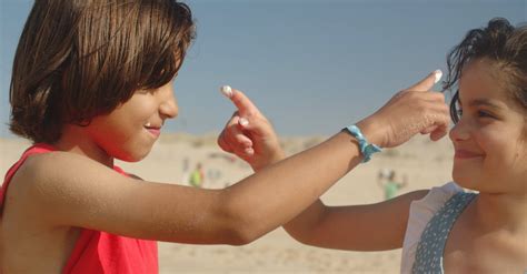 Girls Putting Sunblock Lotion To Each Others Face Free Stock Video