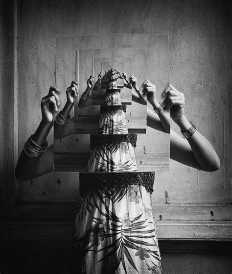 The Woman Is Holding Up Her Hands To Make A Pyramid