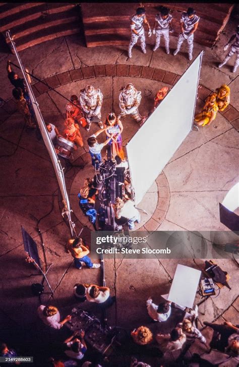 Elevated View Of Cast And Crew Members Some Framed By Two Silk News