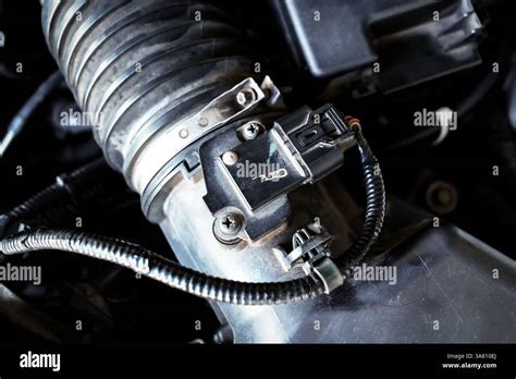 Close Up Of Automotive Mass Airflow Sensor On Air Intake Manifold Of Car Combustion Engine