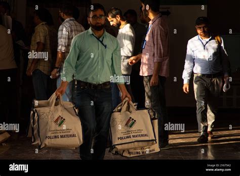 A Kashmiri Polling Official Carrying Polling Material Before Collecting It From A Distribution