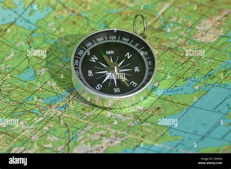 Magnetic Compass Is Located On A Topographic Map A Map With A Compass