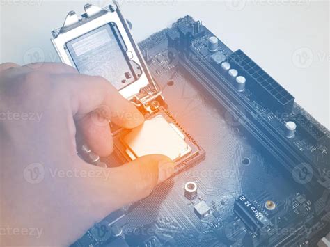 Hold The Cpu Handle And Insert It Into The Cpu Slot On The Motherboard
