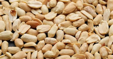 Whole Shelled Peanut Nuts Kernels Close Up On Sliding Platform Stock