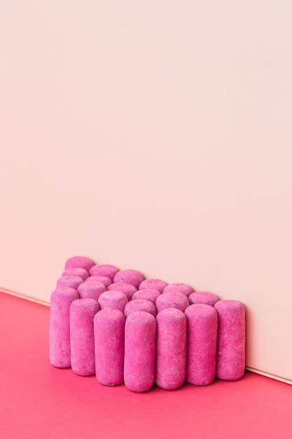 Premium Photo Close Up Of Pink Stack On Table Against Gray Background