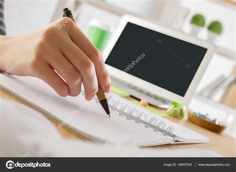 Girl Writing In Notepad Stock Photo Peshkova 148037243