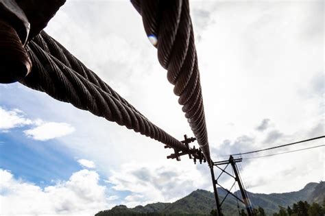 Premium Photo Closeup On A Metal Binding Cable Going In Perspective