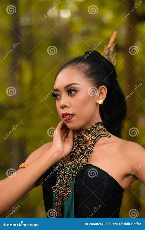 Balinese Woman Wearing Makeup With Red Lips While Feeling While Wearing