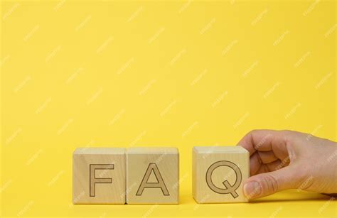 Premium Photo Inscription Faq Frequently Asked Questions On Wooden Blocks On A Yellow