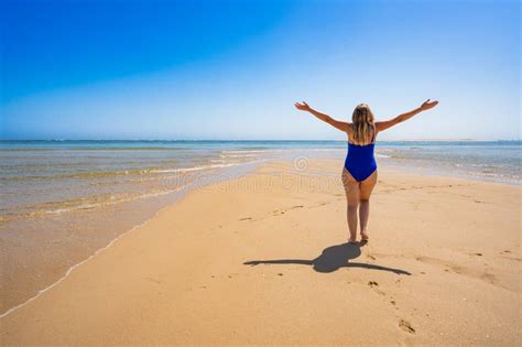 Paradise Beach Beautiful Mature Woman Walking In Shallow Water On