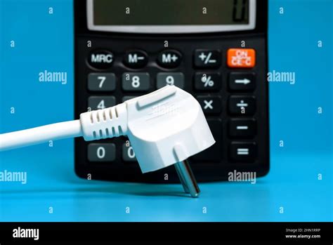 Electricity Growth Concept Calculator And AC Power Plug Stock Photo Alamy