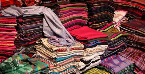 Stacks Of Clothes With Prints Wallpaper Wallpapersok