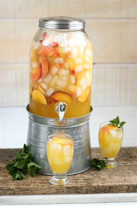 Summer Sangria In A Clear Glass Drink Dispenser With Aluminum Screw On