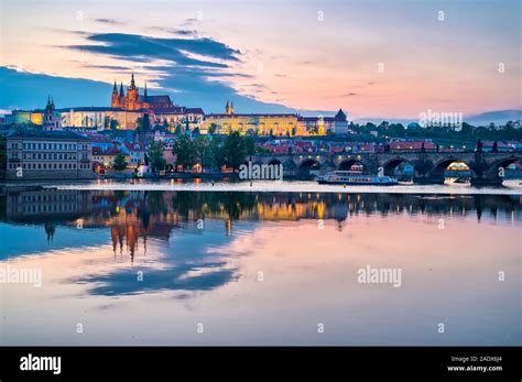 A View Of Prague Castle And The Charles Bridge Across The Vltava River