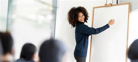 Professional African Woman Presenting And Explaining Strategy During A