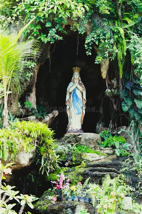 A Statue Of Mother Mary In A Grotto Stock Image Image Of Catholic