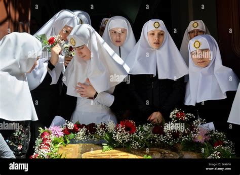 Portrait Of Eastern Orthodox Nuns During A Good Friday Procession In