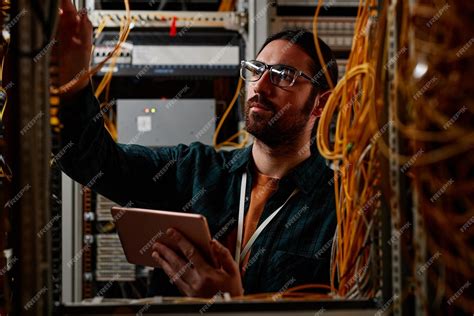 Premium Photo Bearded Man Setting Up Server While Working With Data