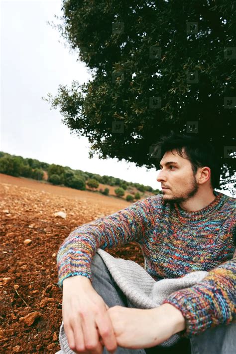 Man Sitting Alone In Nature