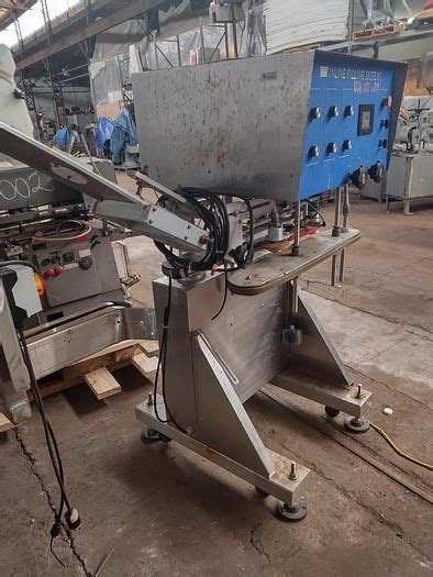 inline filling systems ifs capper with waterfall feeder