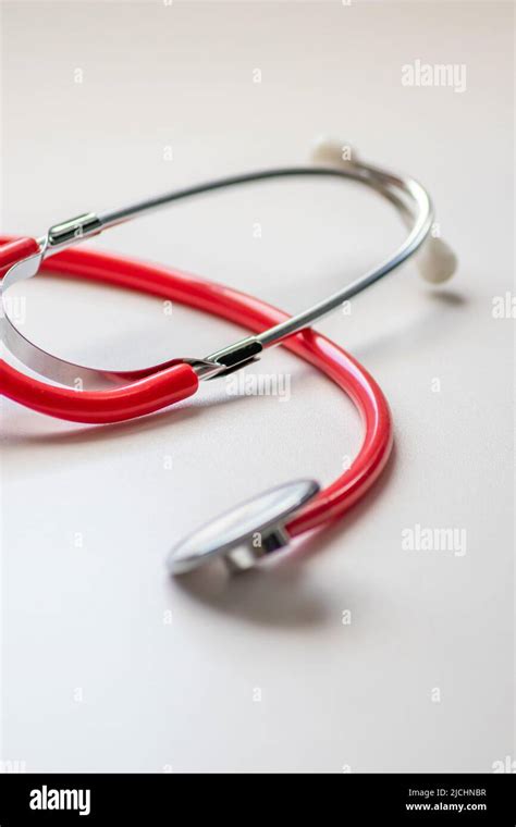 Red Stethoscope In Doctors Office For Professional Cardio Checkup And Healthy Heartbeat Pulse