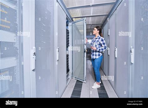 Female Technician Working On Server Maintenance In White Server Room Stock Photo Alamy